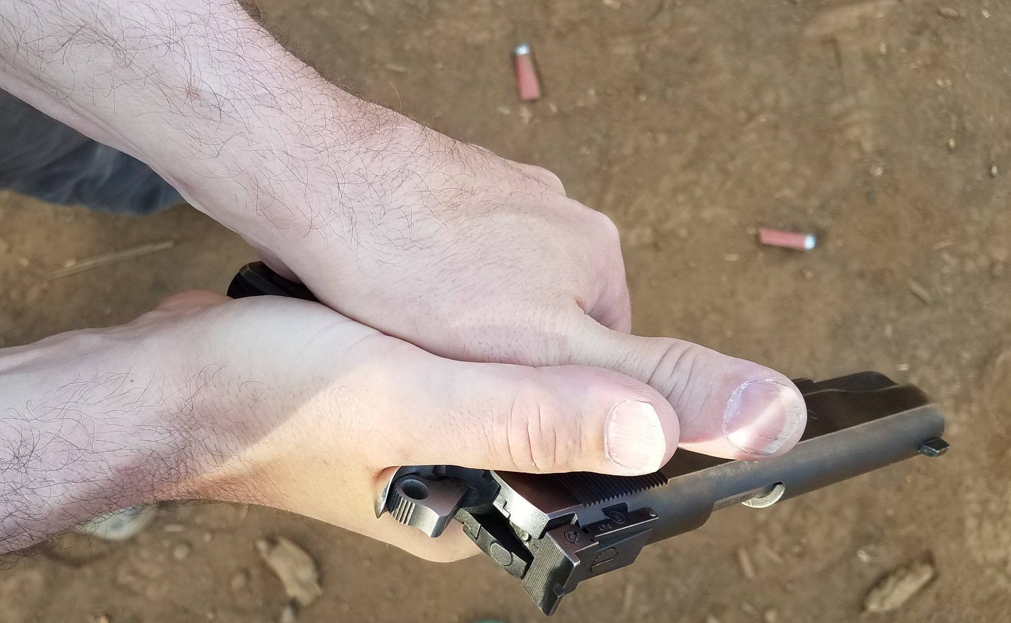 How to Hold a Pistol, Aim and Shoot Correctly - holdrightedge.com