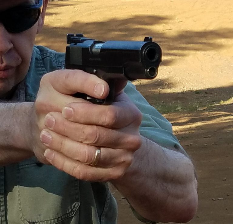 How to Hold a Pistol, Aim and Shoot Correctly - holdrightedge.com